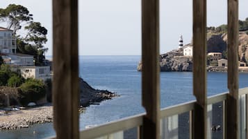 Suíte premium, terraço, vista parcial para o oceano | 1 quarto, frigobar, escrivaninha, cortinas blackout