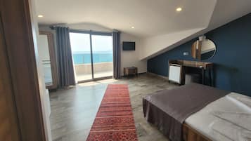 Quarto casal luxo, banheira de hidromassagem, vista para o mar | Roupas de cama premium, frigobar, Wi-Fi de cortesia, roupa de cama