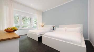 Apartamento Cidade, 2 quartos, cozinha | Roupa de alta qualidade, secretária, quartos insonorizados