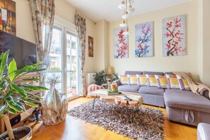 Apartamento Deluxe | Sala de estar | TV de ecrã plano, Netflix