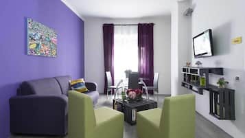 Apartamento, 1 quarto | Sala de estar | TV de ecrã plano