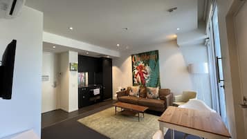 Apartamento | Sala de estar | TV de ecrã plano