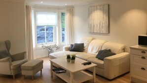 Apartamento Deluxe, 2 quartos | Sala