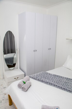 Apartamento Familiar, 2 quartos, varanda | 2 quartos, lençóis de algodão egípcio, com decoração personalizada 