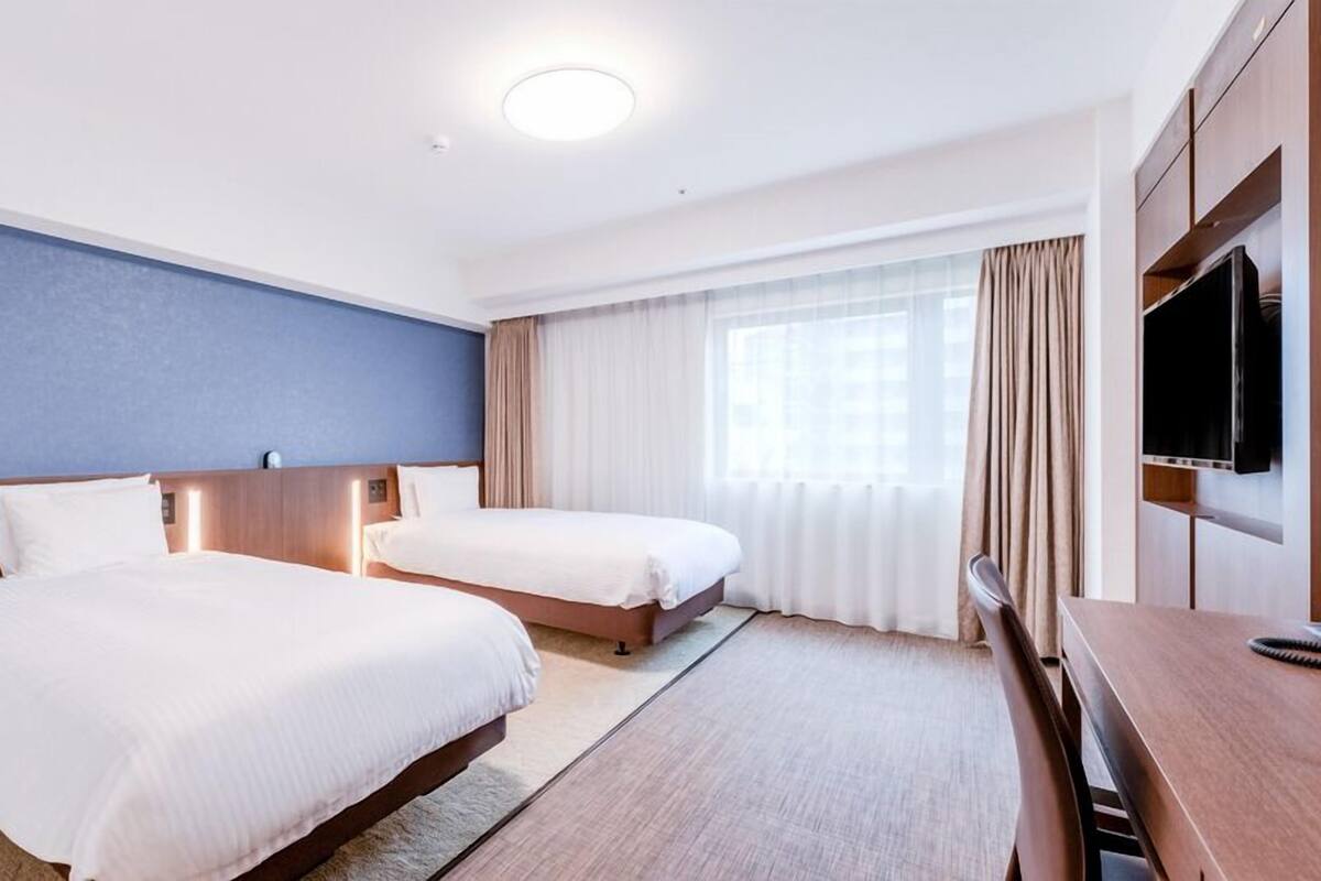 Edredons de pluma, cortinas blackout, Wi-Fi de cortesia, roupa de cama