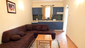 Apartamento, 1 quarto | Área de estar | TV LCD