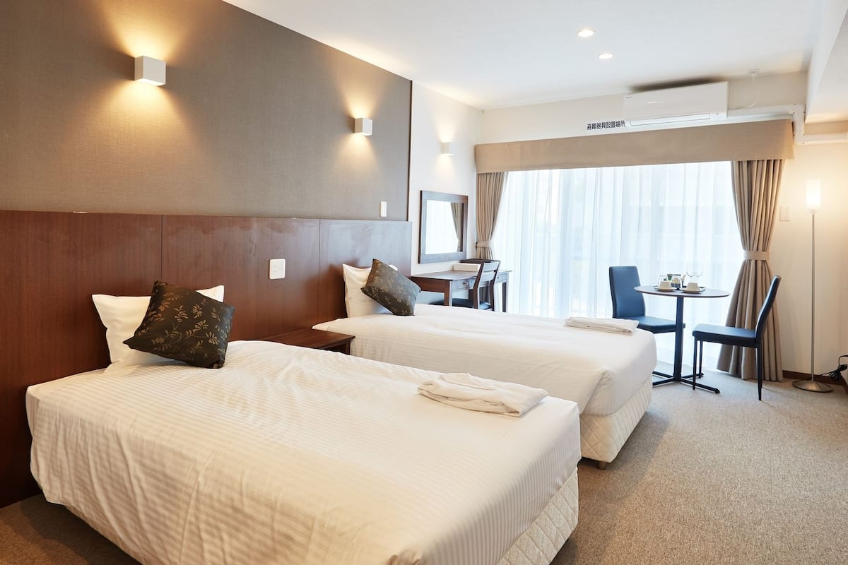 Quarto Twin (Condominium Type, A) | Cortinas/cortinados opacos, Wi-fi grátis, roupa de cama fornecida