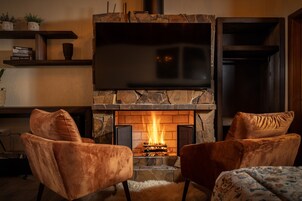 Suíte grand | Área de estar | TV de tela plana