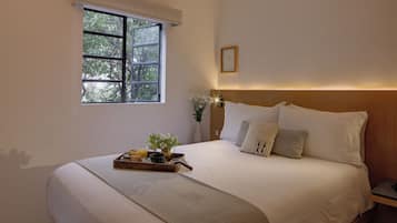 Suíte | Roupas de cama premium, cofres nos quartos, cortinas blackout