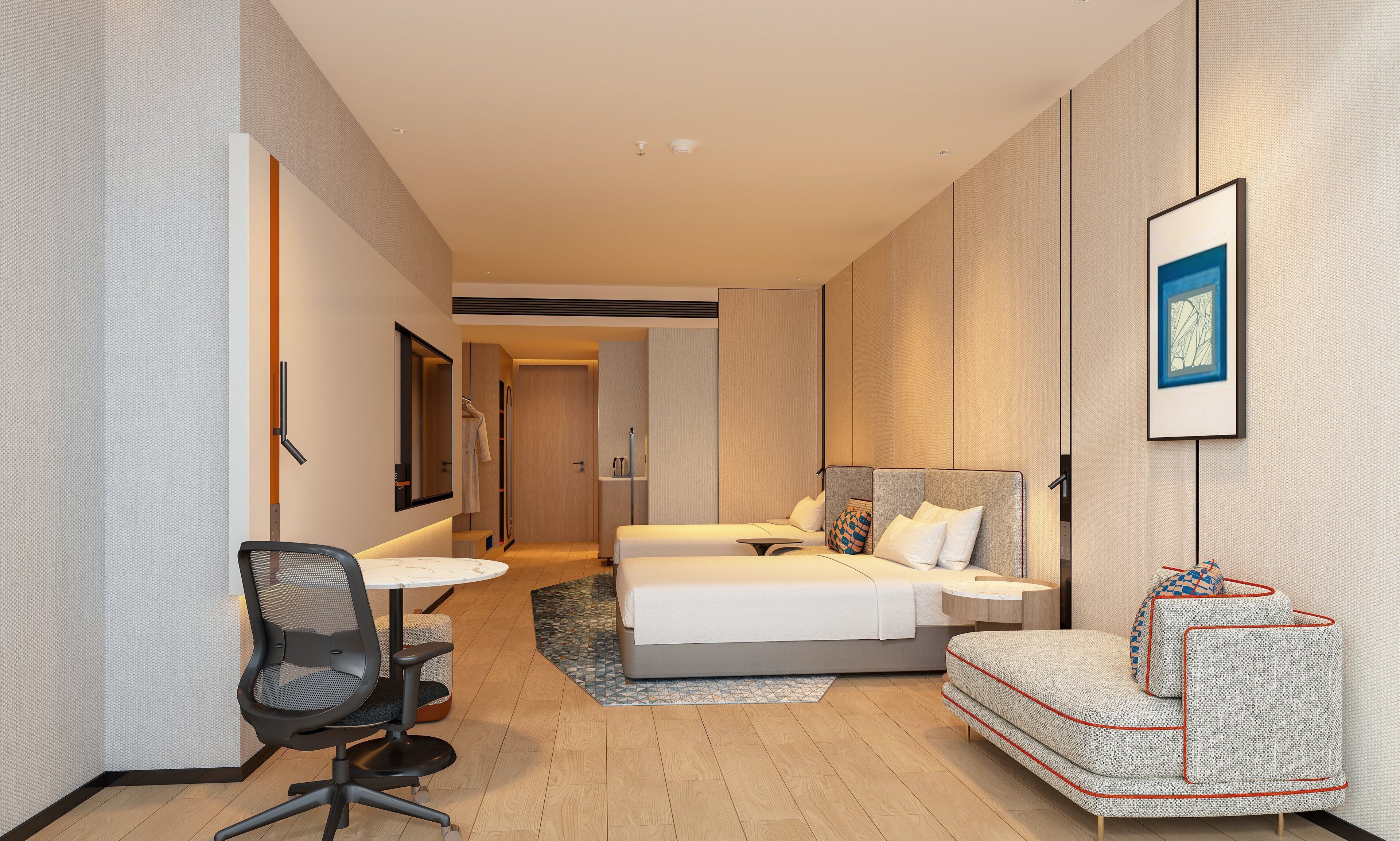 Quarto de hotel moderno com cama, escrivaninha, cadeira e uma moldura na parede.