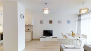 Apartamento | Sala de estar | TV de ecrã plano