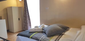 Apartamento, 1 quarto | 1 quarto, roupas de cama premium, edredons de pluma