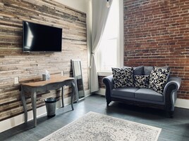 Estúdio superluxo, 2 camas de casal (206) | Área de estar | TV de tela plana 42 polegadas com canais digitais, TV, Netflix