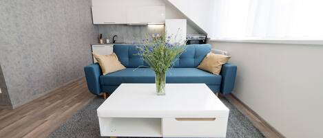Suite Deluxe, 1 quarto, não fumadores | Sala de estar | TV de ecrã plano