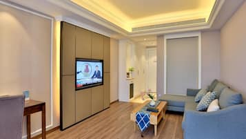 Suíte luxo, 1 cama King | Frigobar, cofres nos quartos, escrivaninha