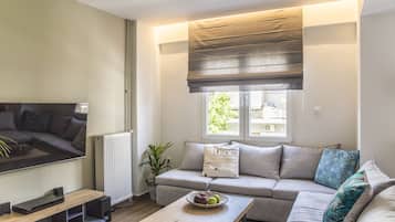 Apartamento Deluxe, 4 quartos, varanda, Vista para a cidade | Sala