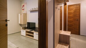 Suite Cidade, 1 quarto, Vista para a cidade | Sala de estar