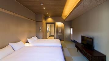 Quarto Twin Deluxe | 1 quarto, cofre no quarto, secretária, quartos insonorizados