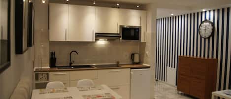 Apartamento conforto (BOSTON) | Área de estar | TV de tela plana