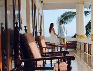 Quarto superior, vista parcial para o mar | Terraço/pátio