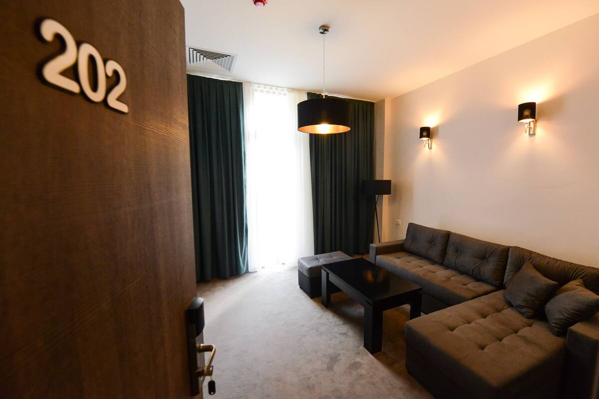 Apartamento luxo | Área de estar | TV de tela plana