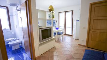 Apartamento | Sala de estar | Televisor