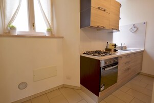 Apartamento, 1 quarto | Cozinha americana privada | Cafeteira/chaleira, geladeira