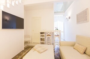 Suíte luxo | Sala de estar | TV