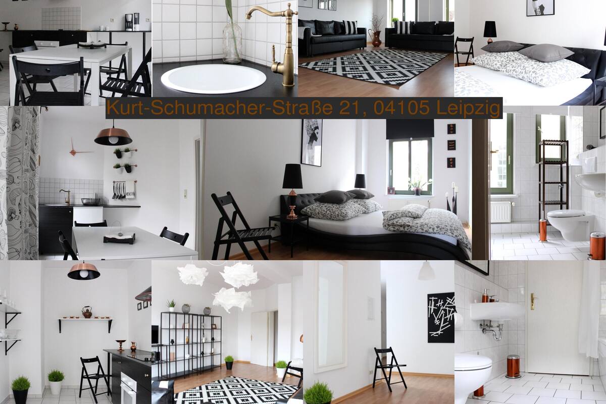 Um apartamento moderno com cozinha, sala de jantar, sala de estar e quarto. Apresenta um esquema de cores preto e branco e mobiliário contemporâneo.