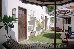 Quarto duplo básico, vista para o jardim | Vista do quarto