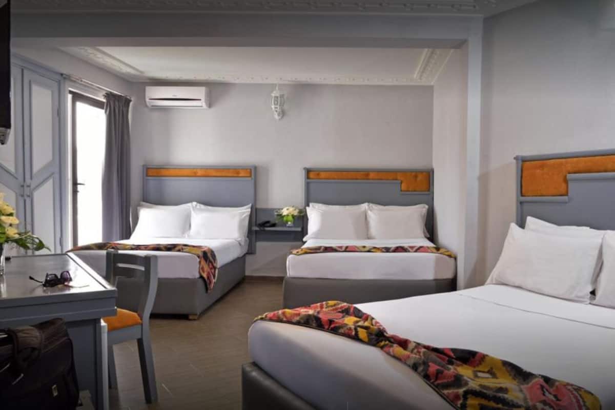 Quarto triplo | Frigobar, Wi-Fi de cortesia, roupa de cama