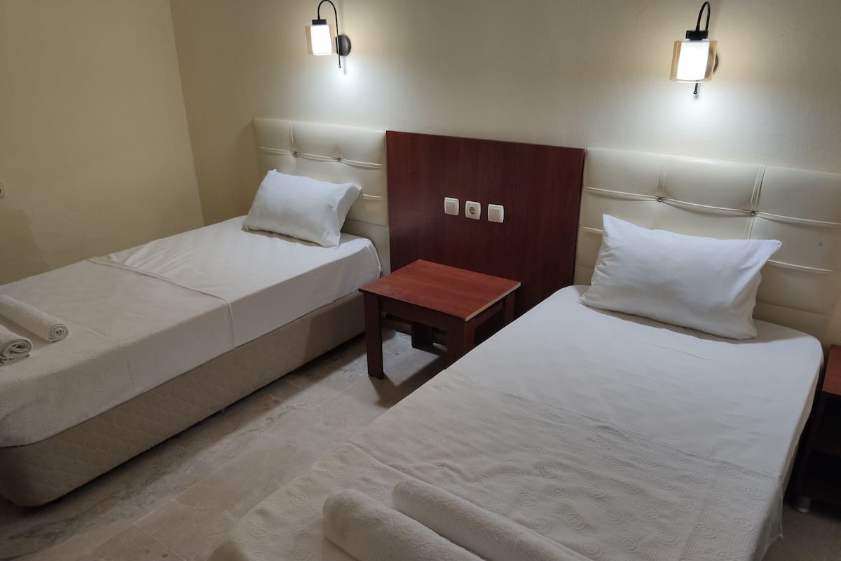 Quarto standard, vista para o mar | Escrivaninha, Wi-Fi de cortesia, roupa de cama