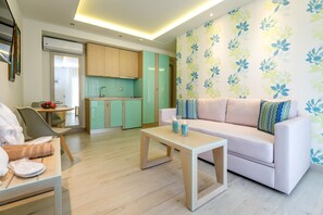 Suíte luxo | Sala de estar | TV de tela plana