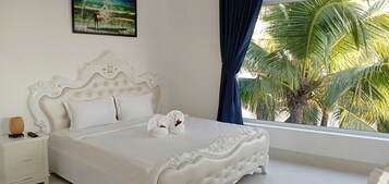 Quarto luxo, vista para o oceano | Frigobar, escrivaninha, cortinas blackout, ferros/tábuas de passar roupa