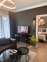 Suíte luxo, 1 quarto, no andar executivo | Área de estar | Pisos aquecidos