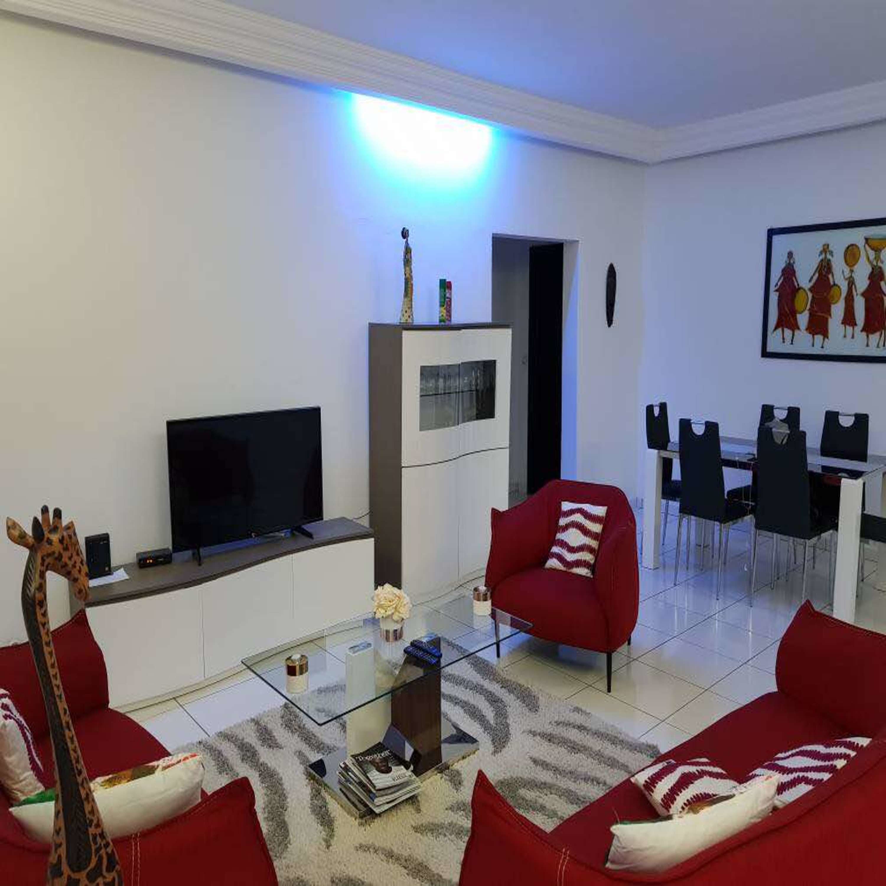 Suíte estúdio conforto, 1 quarto | Área de estar | TV LCD