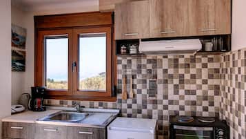 Vila elite, vários quartos, piscina particular, vista para o mar | Cozinha americana privada | Geladeira, fogão, cooktop, cafeteira/chaleira