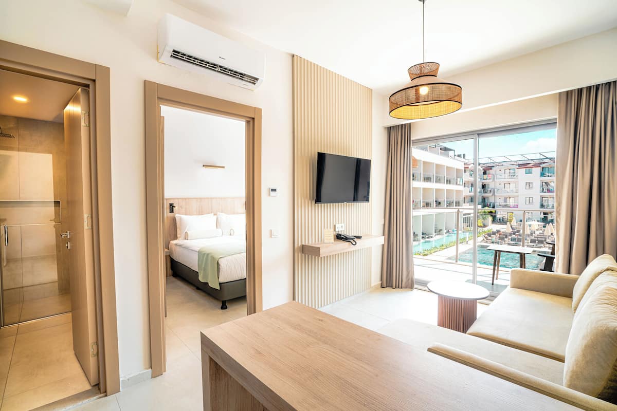 Suite Deluxe | Roupa de alta qualidade, minibar, cofre com capacidade para portátil 