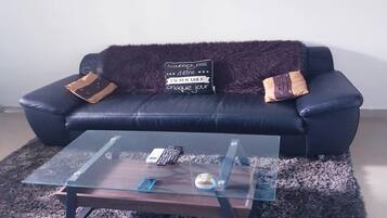 Suíte estúdio conforto | Área de estar | TV de plasma