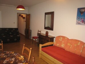 Apartamento, 1 quarto (D o l s a ) | Sala de estar | TV de ecrã plano 