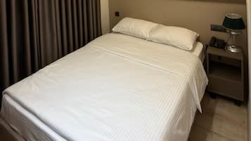 Quarto Individual | Minibar, cofre no quarto, quartos insonorizados, Wi-fi grátis