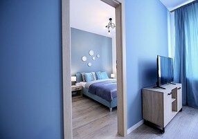 Apartamento luxo, 1 quarto | Cortinas blackout, ferros/tábuas de passar roupa, berços grátis