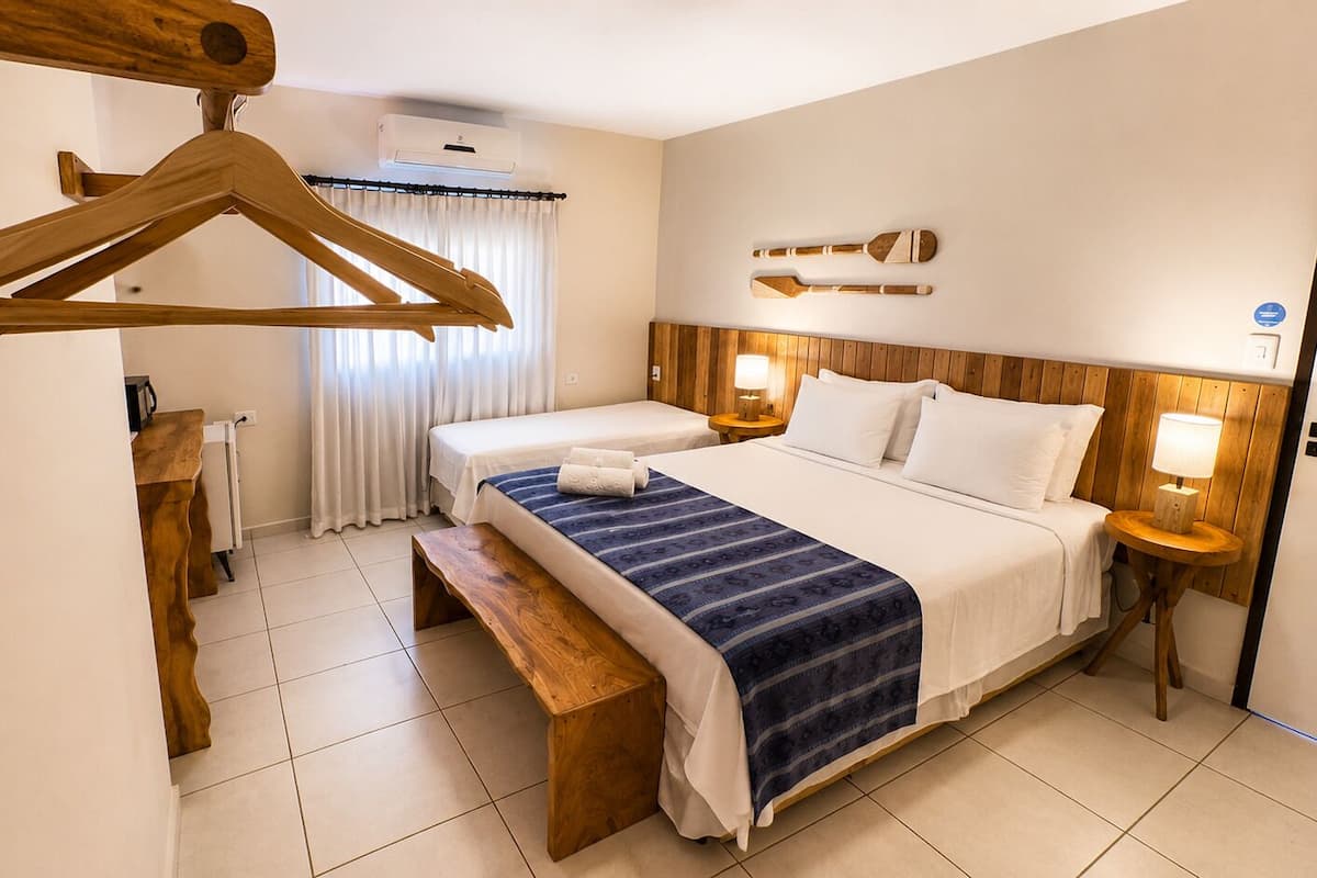 Suíte standard, vista para o jardim | Frigobar, Wi-Fi de cortesia, roupa de cama