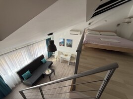 Duplex premium | Área de estar | TV de tela plana