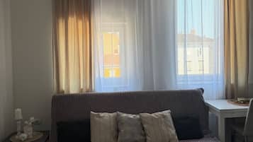 Dúplex Superior | Sala de estar | TV de ecrã plano