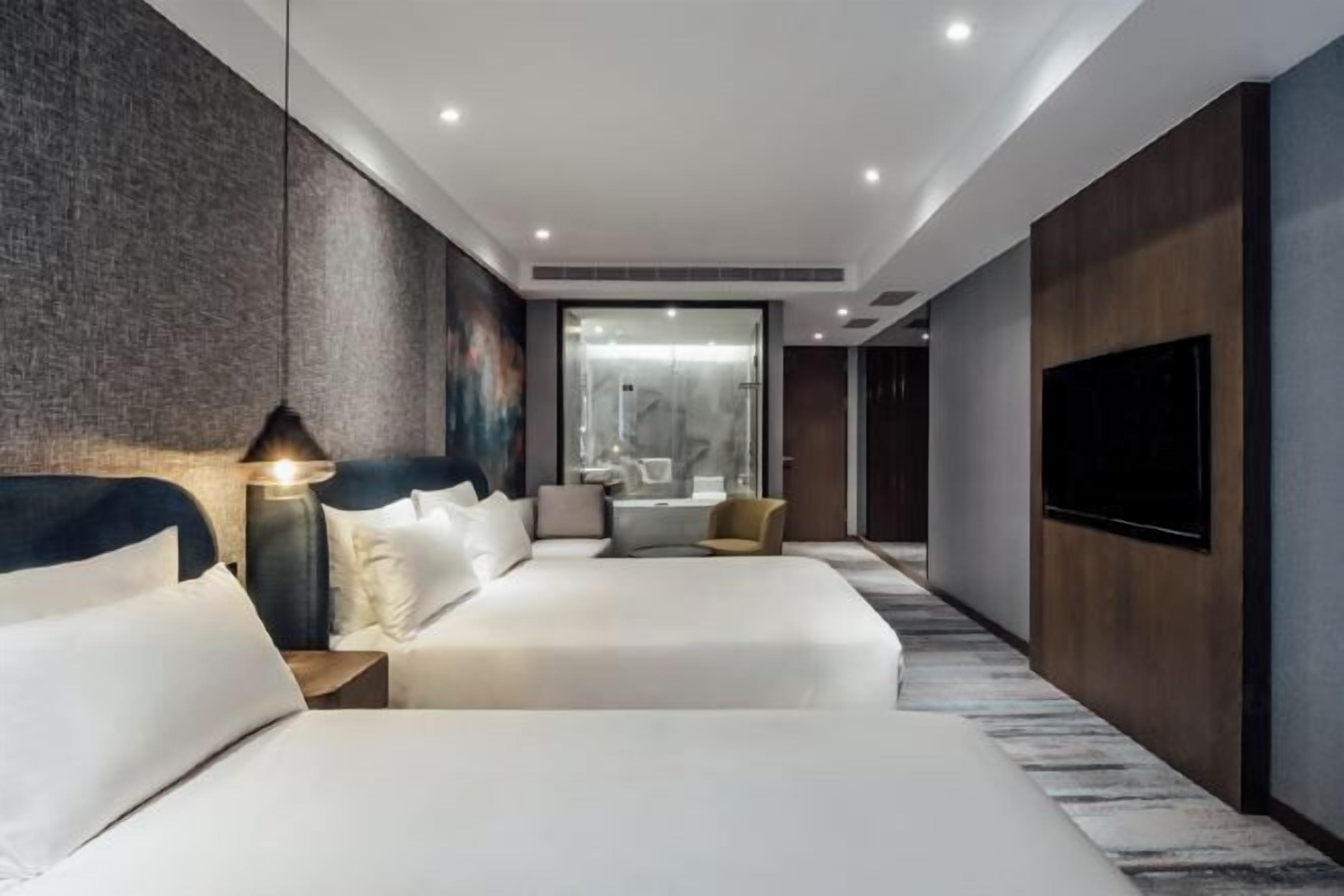 Roupas de cama premium, cofres nos quartos, individualmente mobiliados