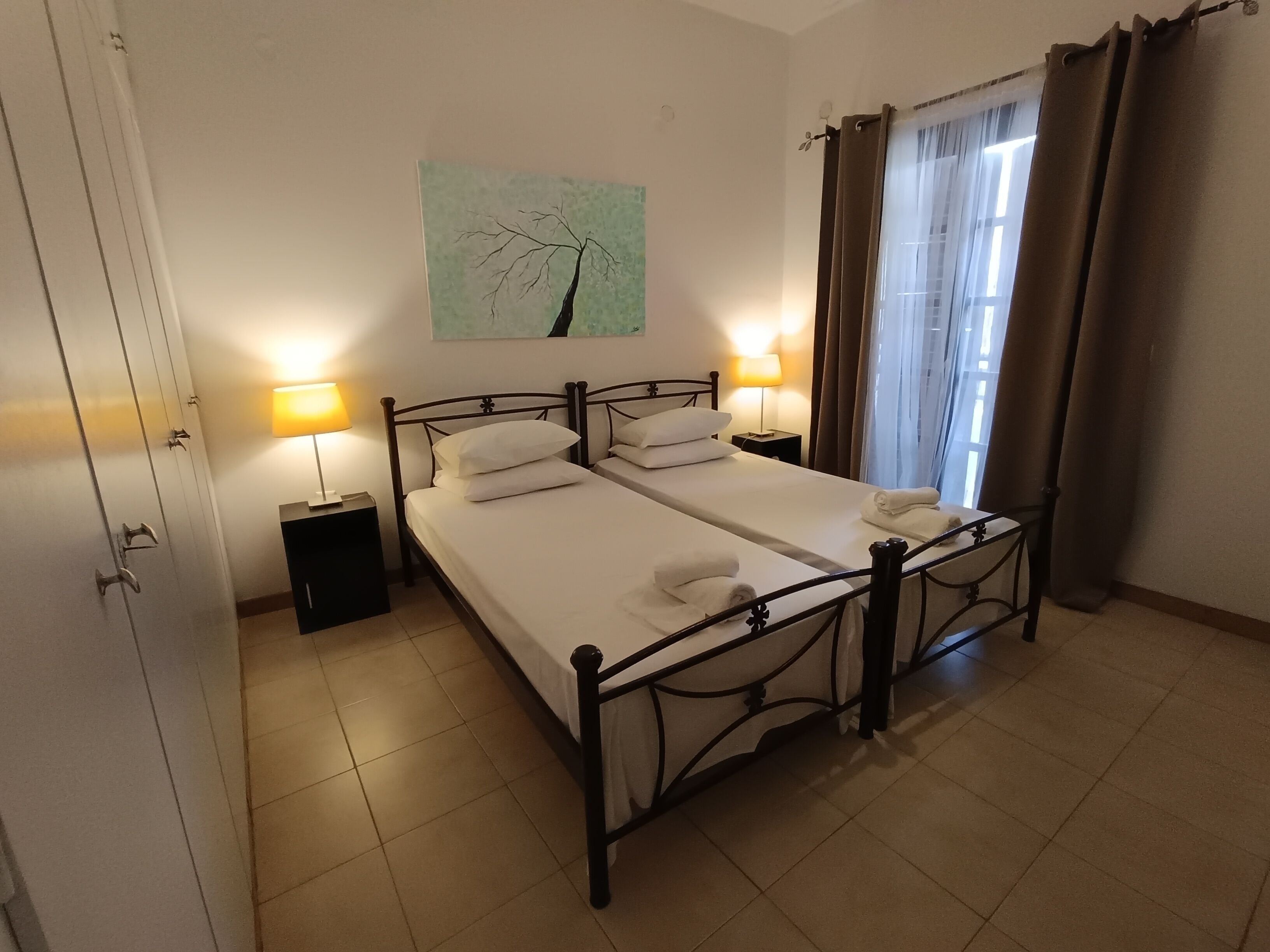 Apartamento, 3 camas individuais | 1 quarto, com decoração personalizada, com mobília individualizada 