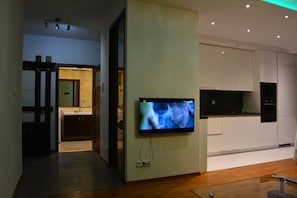 Apartamento Exclusivo, 1 quarto | Sala | TV de ecrã plano 
