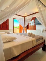 Suite Deluxe | Frigobar, Wi-Fi de cortesia, roupa de cama