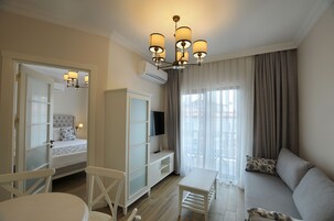 Apartamento standard | Área de estar | TV LCD